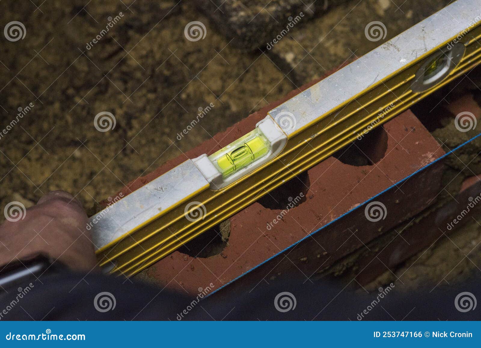 Occupation: Bricklayer Using a Spirit Level - Construction Industry. 1 ...