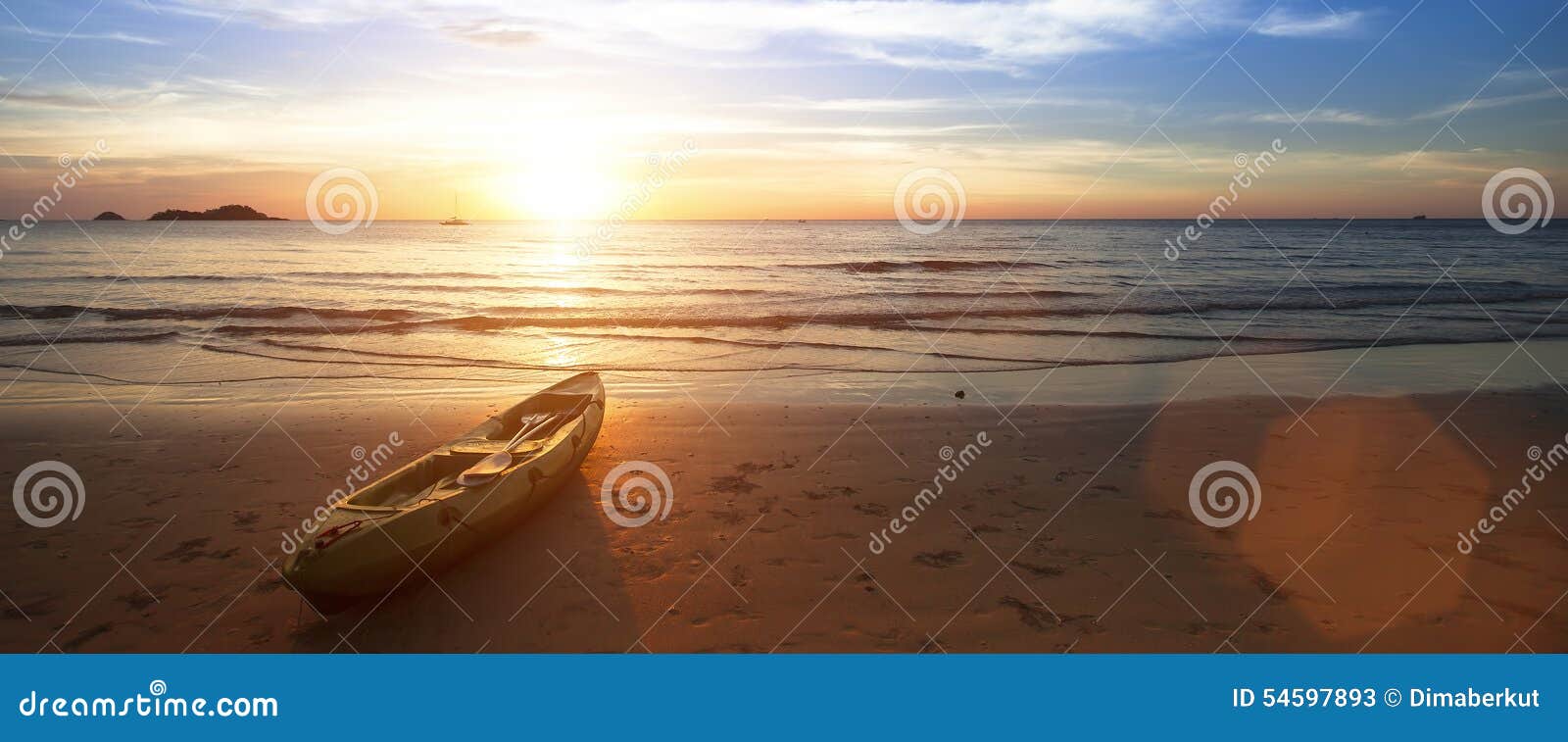 Ocean Beach, Canoe Lying on the Shore during Wonderful Sunset . Stock ...