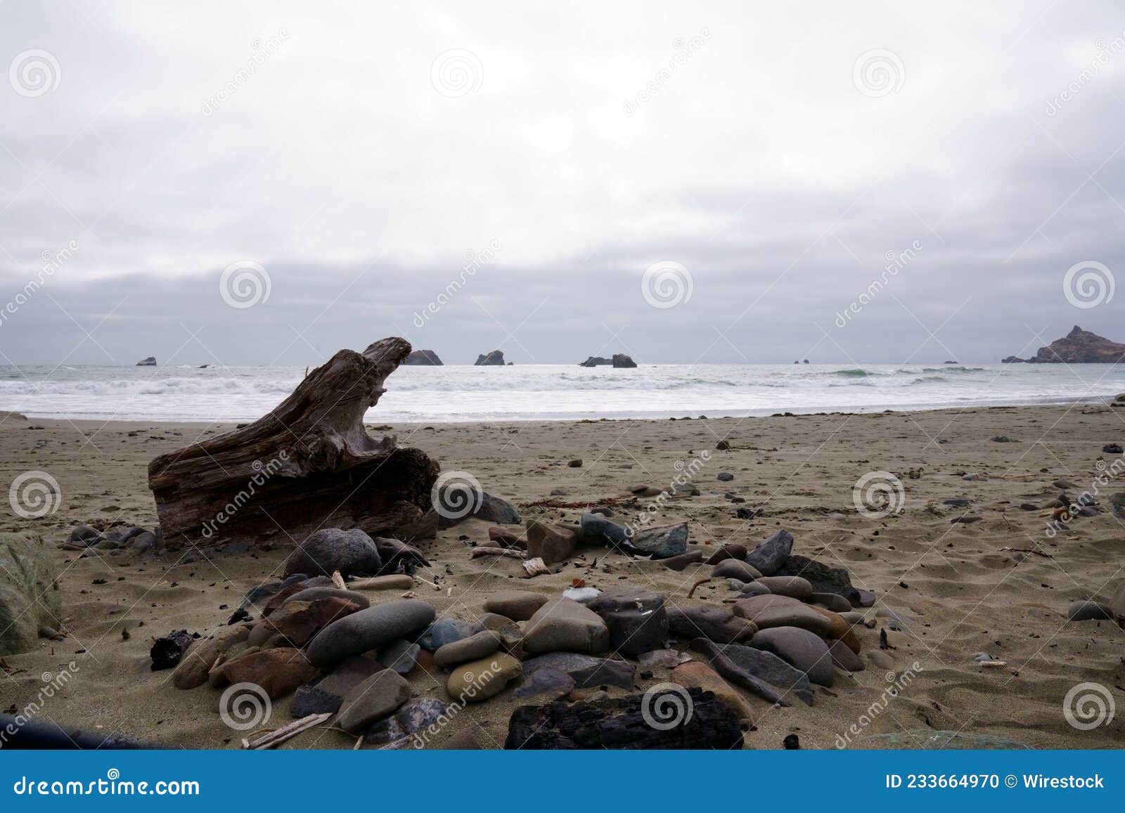 Ocean beach fire pit stock photo. Image of stones, sand - 233664970