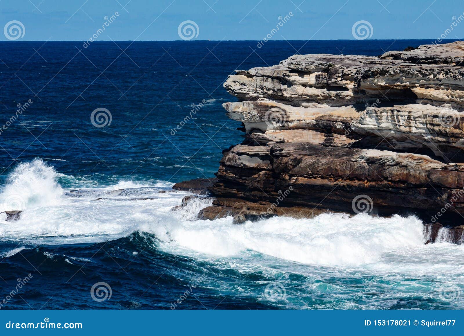 Oceanside Rocky Sandstone Cliff with Blue Sea Water Waves Creating ...