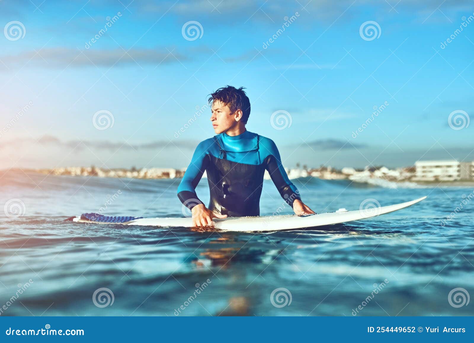 The Ocean is Educating and Lots of Fun. a Young Boy Out Surfing. Stock ...