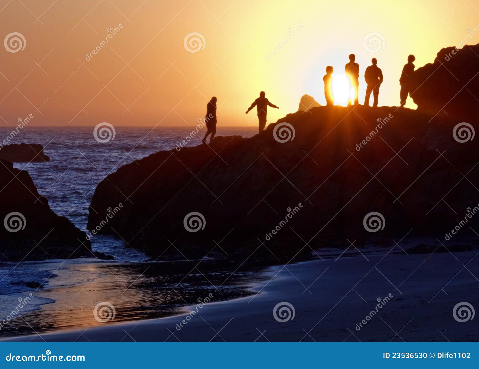 Ocean Sunset Watchers stock photo. Image of seashore - 23536530