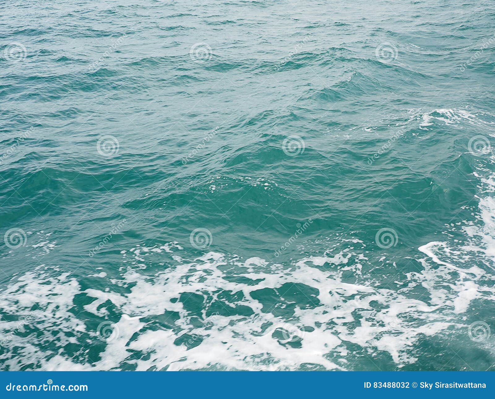 Waves On The Surface Of The Sea Water At Dusk With Compact, Solid And ...