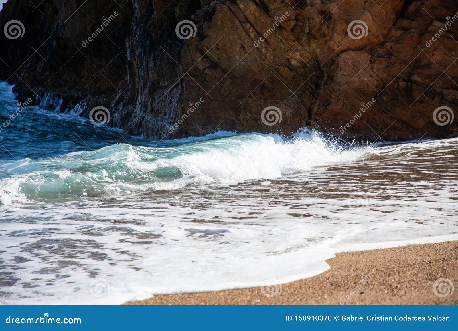 Ocean wave near beach rock stock photo. Image of majestic - 150910370