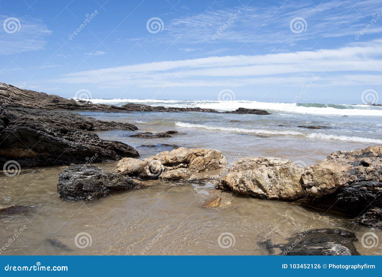 Ocean Waves Approaching Big Rocks on Shore Stock Photo - Image of shore ...
