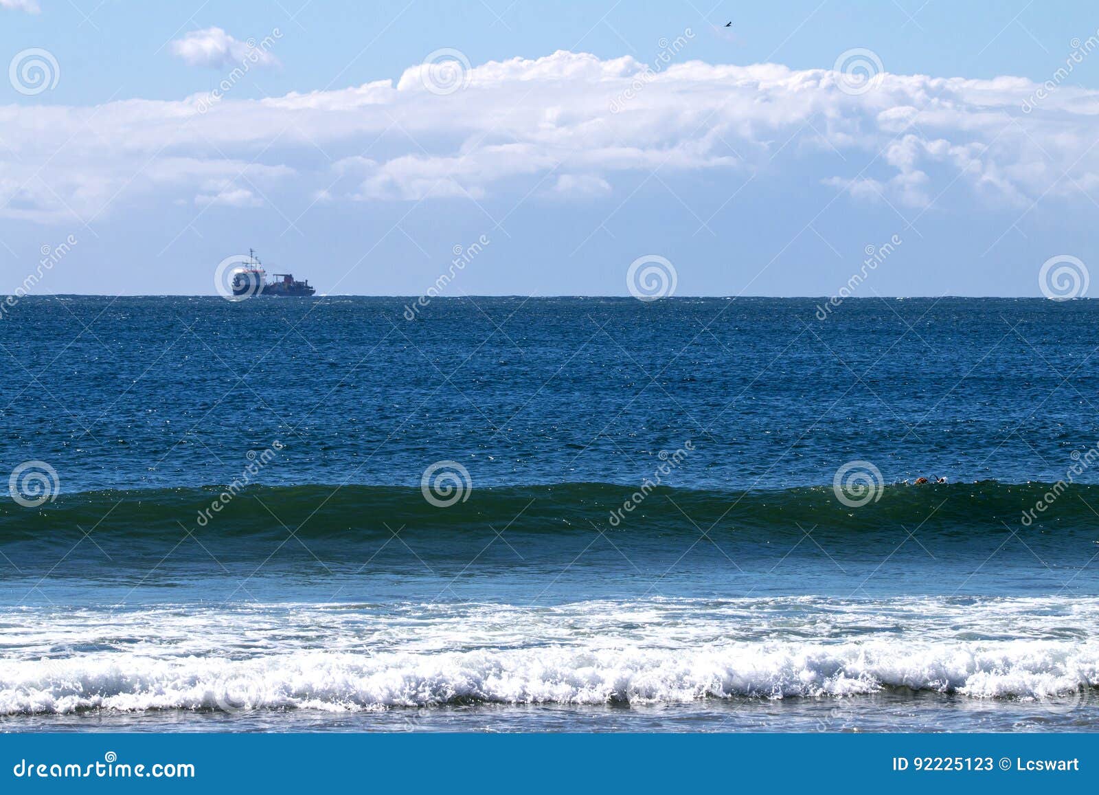 Ocean and Waves and Container Vessel on Cloudy Skyline Stock Image ...