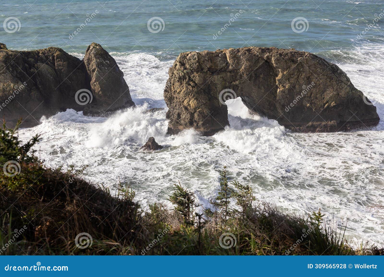 The Ocean Waves Crash Against the Rocks, Creating a Powerful and ...