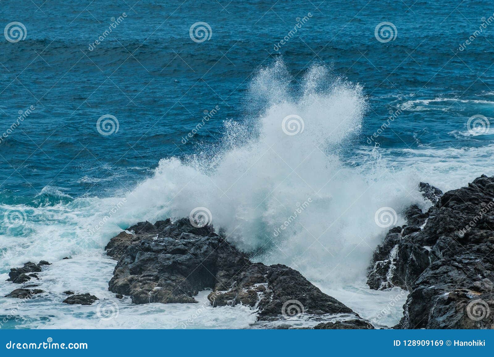 Ocean Waves Crashing Against Black Rocks on Coast Stock Image - Image ...