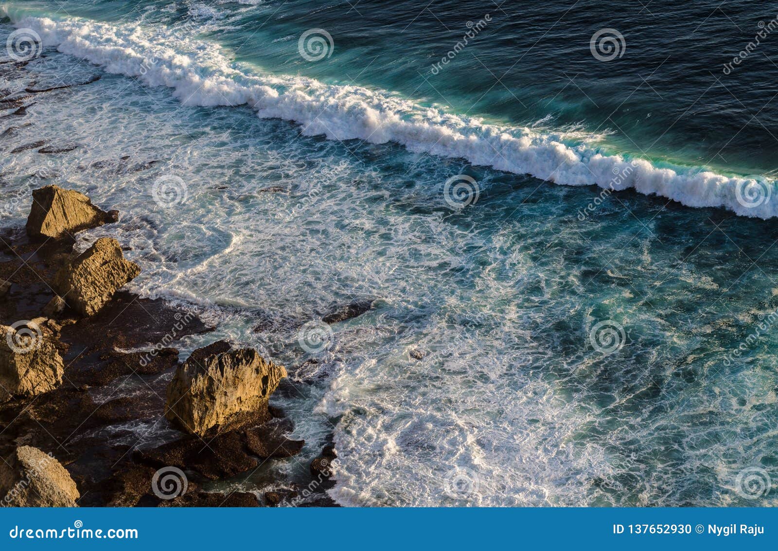 Ocean waves hitting rocks stock photo. Image of relax - 137652930