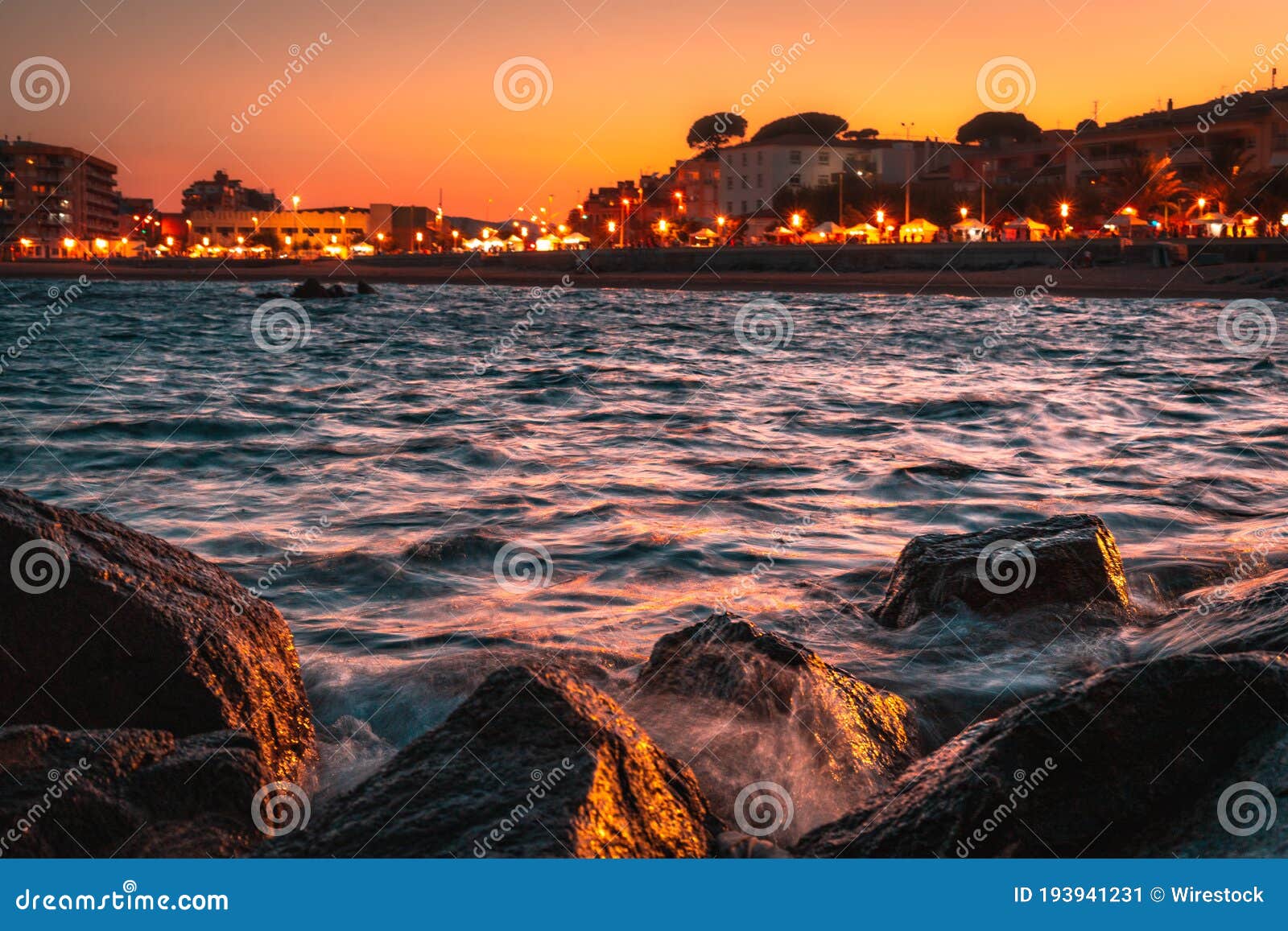 Ocean Waves Hitting the Rocks and Gleaming Under the Sunset Stock Image ...