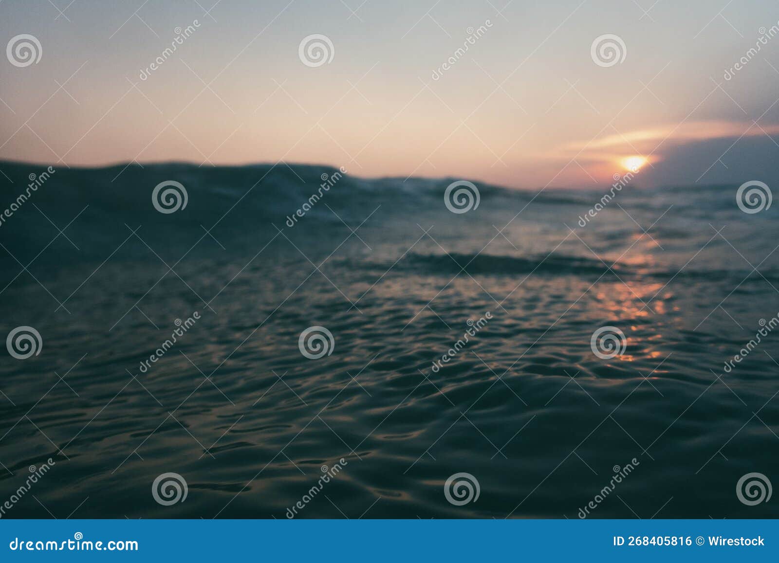 Ocean Waves and Ripples at Sunset with Pink and Orange Sky Stock Photo ...