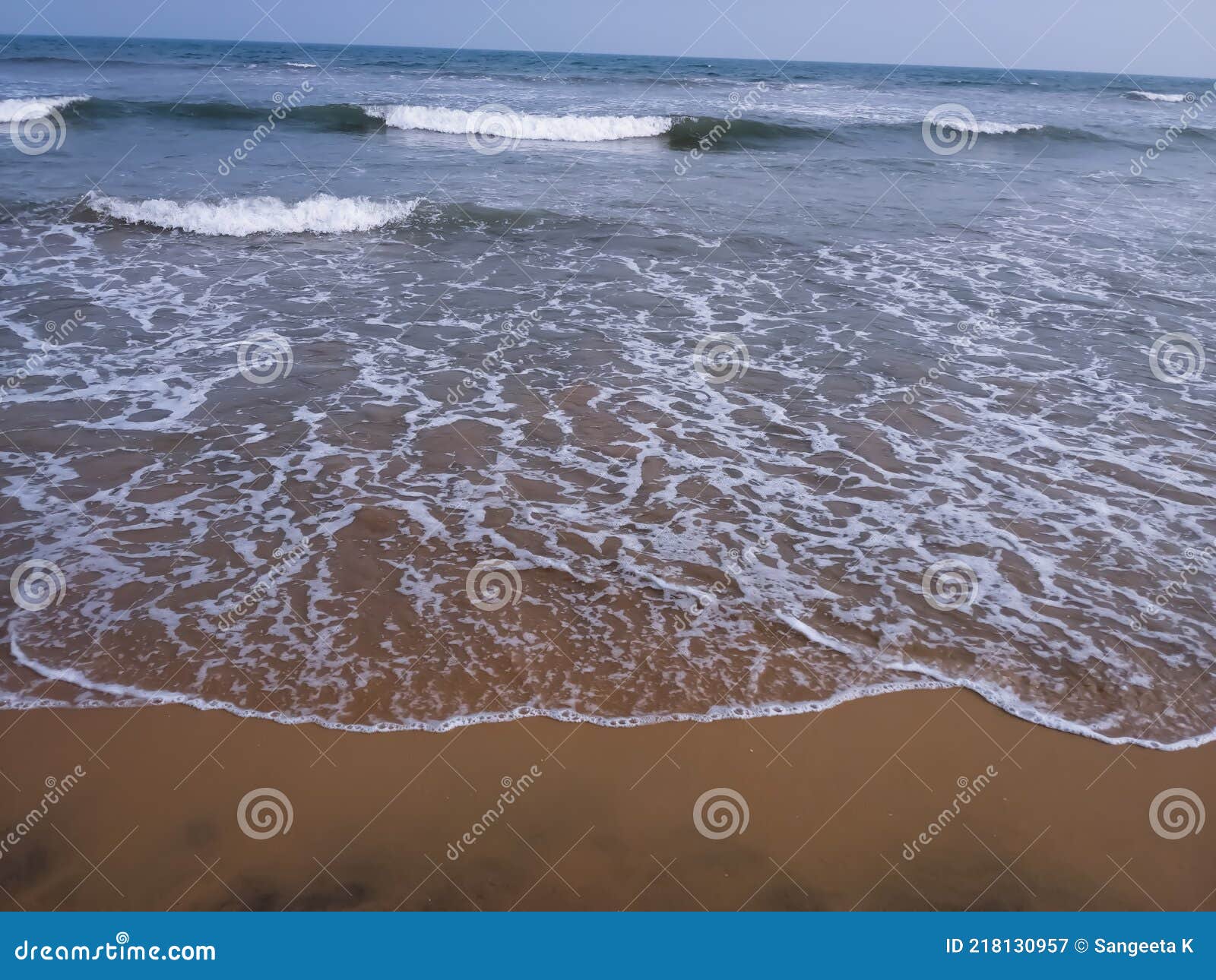 Ocean waves in sand beach stock image. Image of waves - 218130957