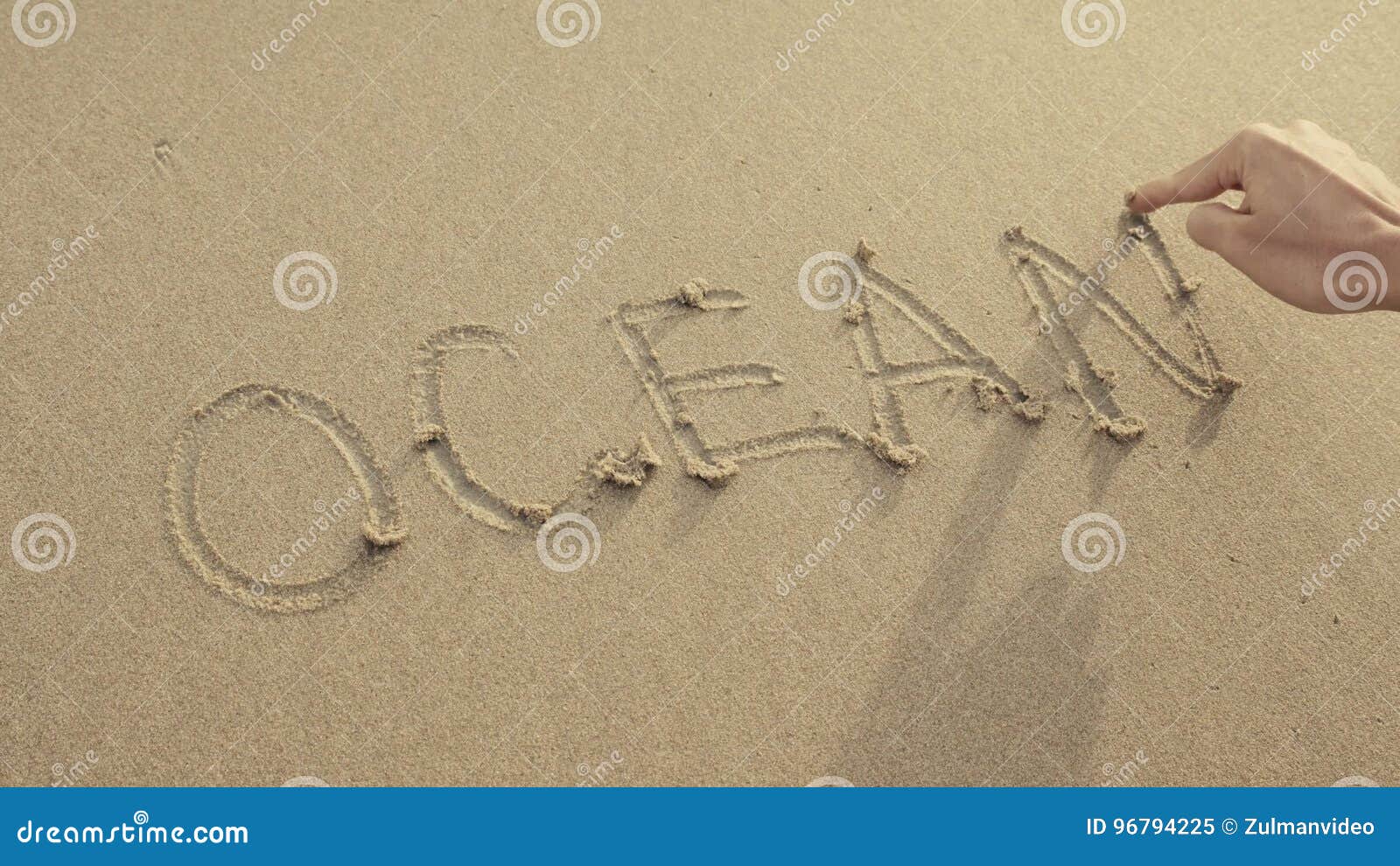 OCEAN Written on the Beach Sand Washed Aways by Waves. Stock Image ...