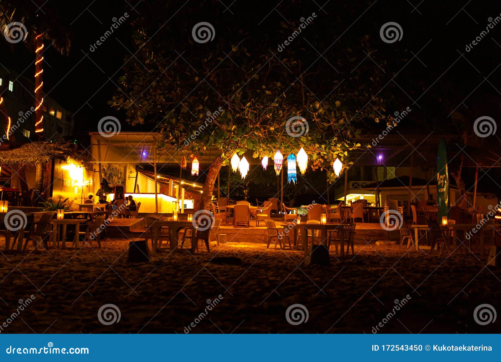 Oceanfront Restaurant with Lights and Tables on a Sandy Beach Stock ...