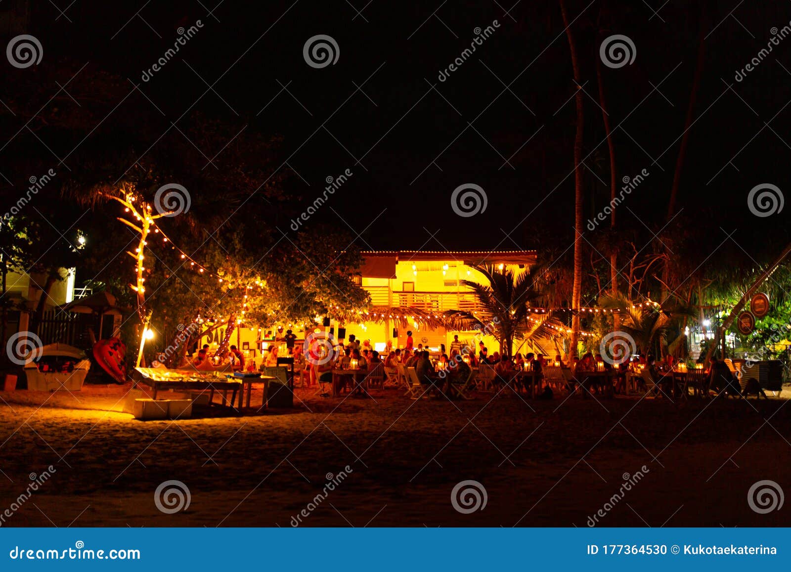 Oceanfront Restaurant with Lights and Tables on a Sandy Beach Stock ...
