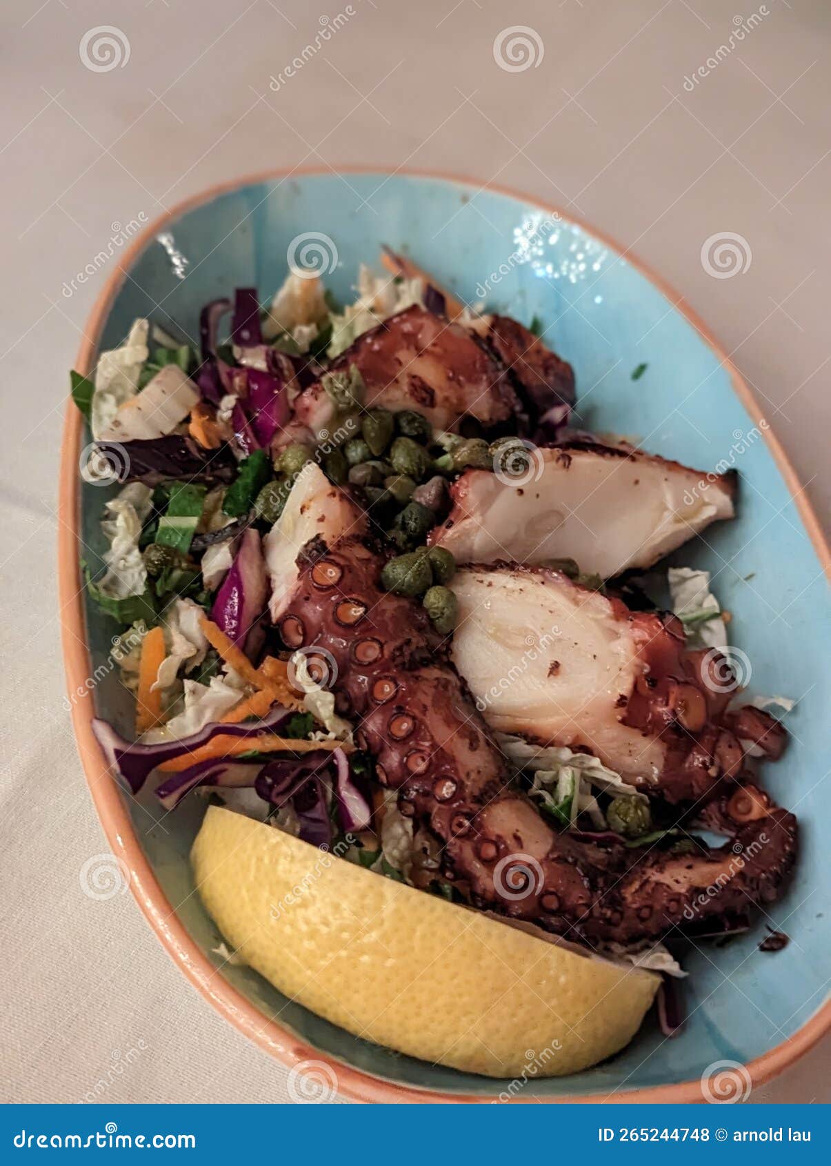 Octopus appetizer lemon stock photo. Image of fish, lunch - 265244748