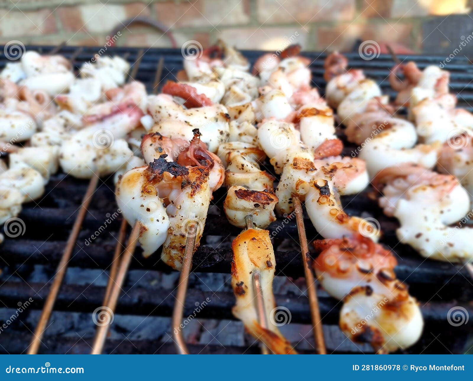 Octopus on a Barbecue Grilled on Charcoal Grill Stock Photo - Image of ...
