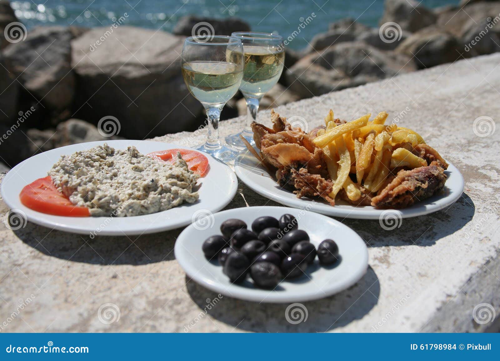 Octopus, Chips, Olives by the Sea Stock Photo - Image of assorted ...
