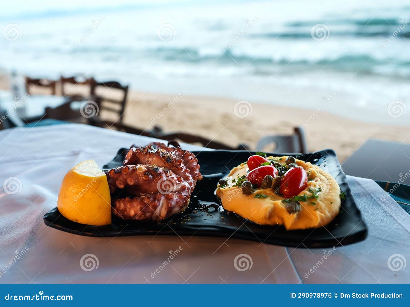 Octopus with Puree on a Table in a Restaurant Stock Photo - Image of ...