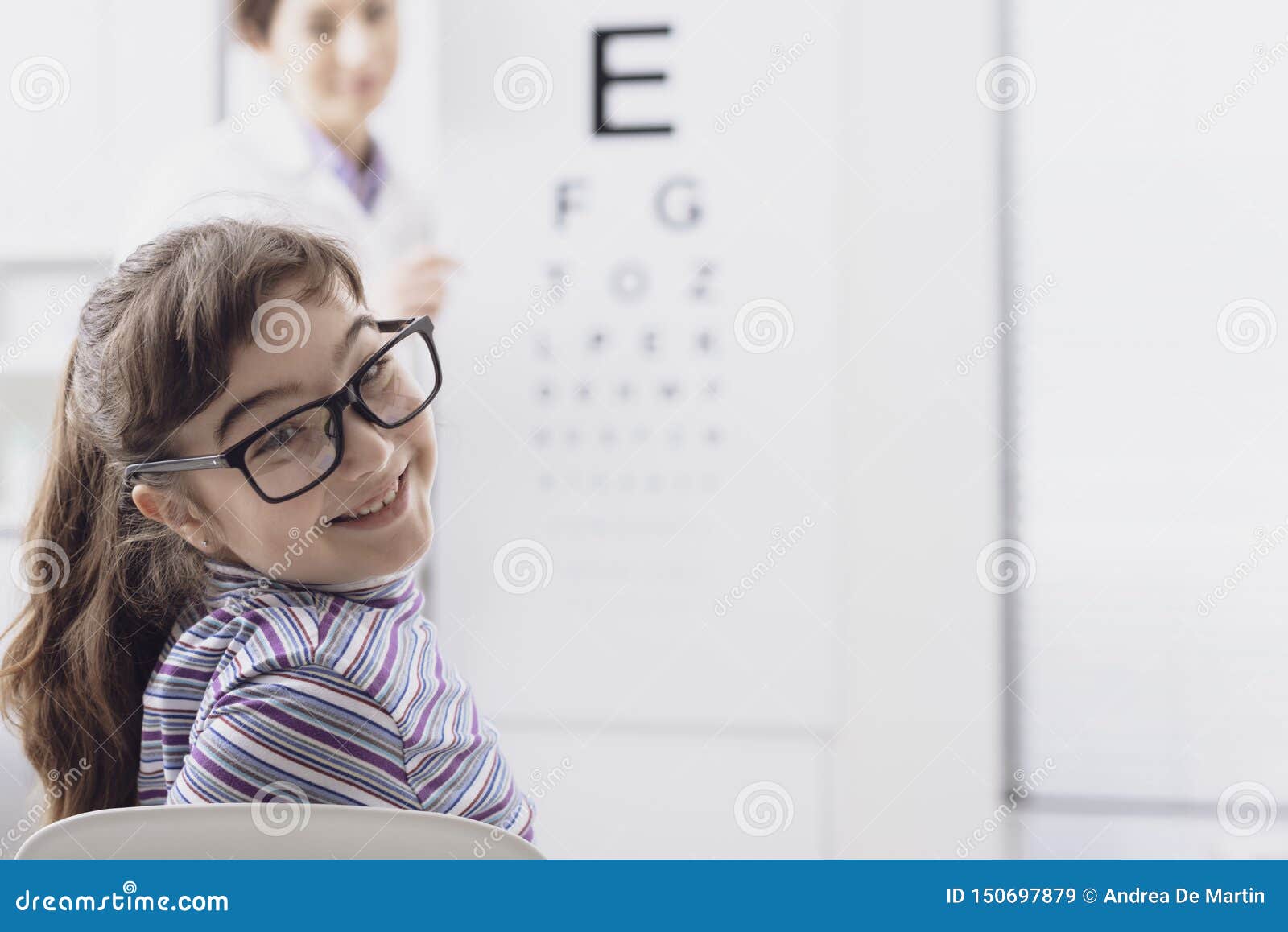 Oculist Testing a Young Patient`s Eyesight Using an Eye Chart Stock ...