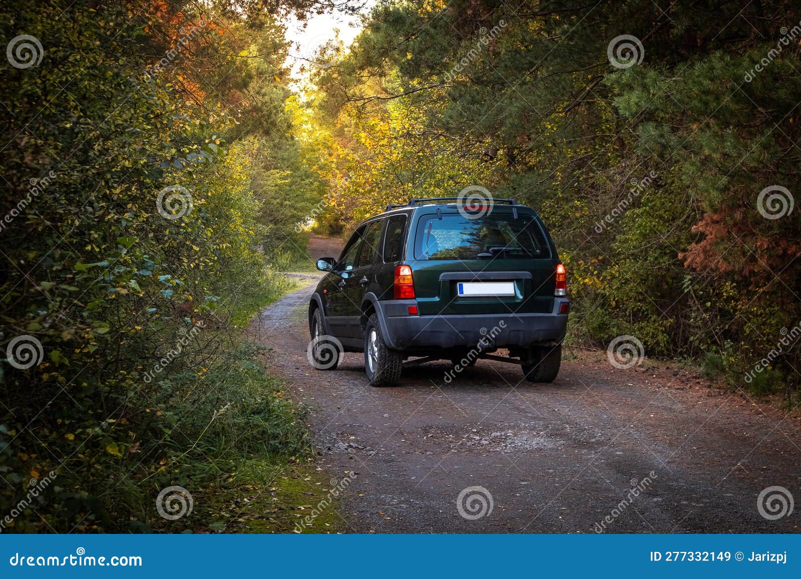 Off-road Car Driving through the Forest in Autumn. Stock Image - Image ...