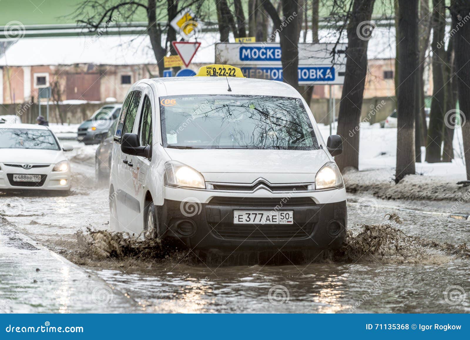 Off-road in Russia. the Car Rides on a Deep Puddle in the Spring ...