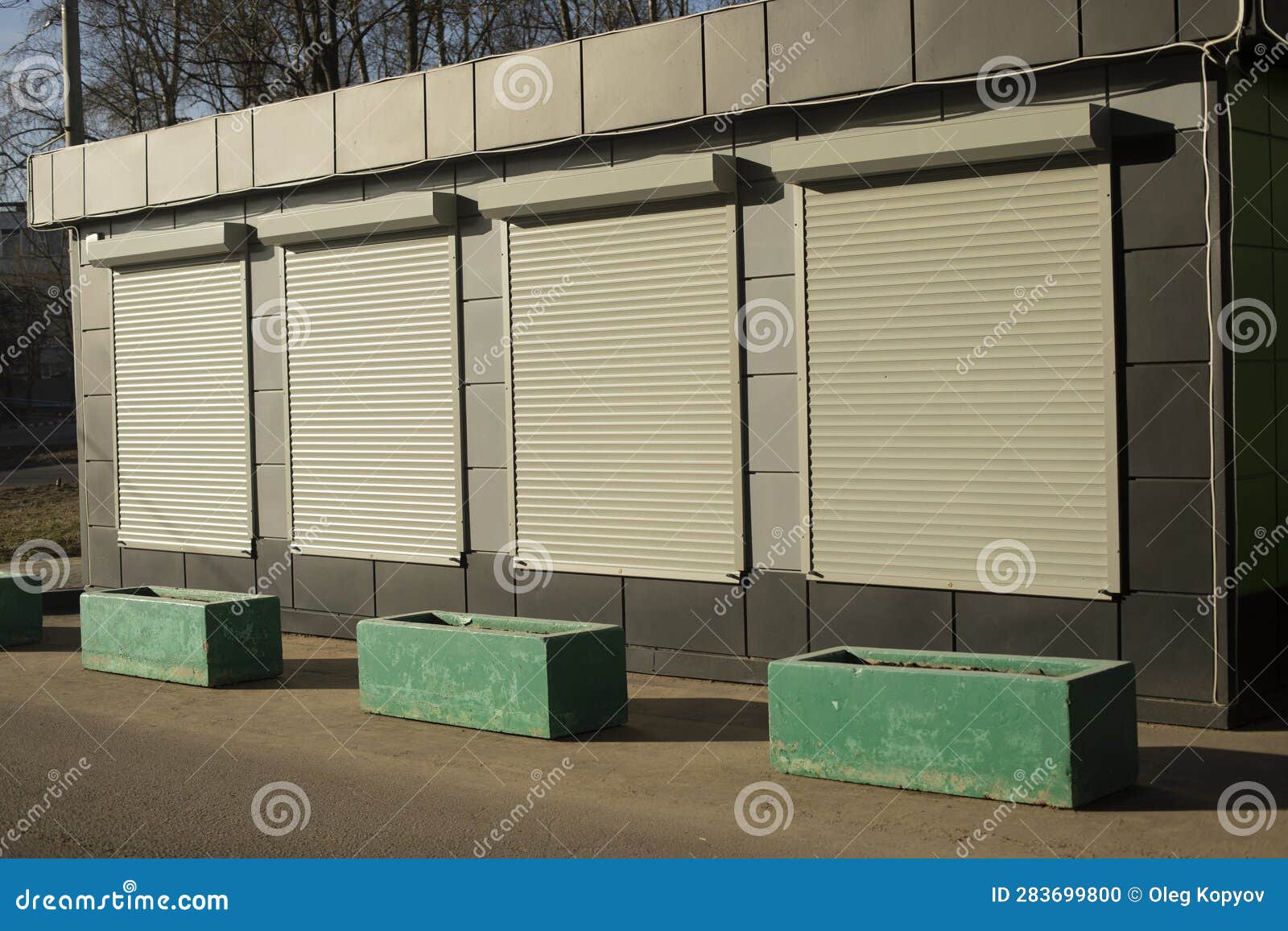 Office Building with Shutters on Windows. Small Shop Stock Photo ...