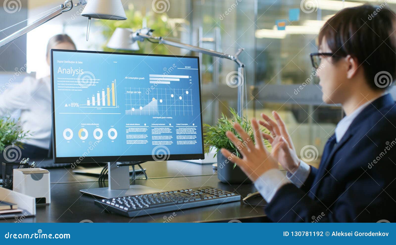 In the Office Businessman Using Personal Computer with Statistic Stock ...