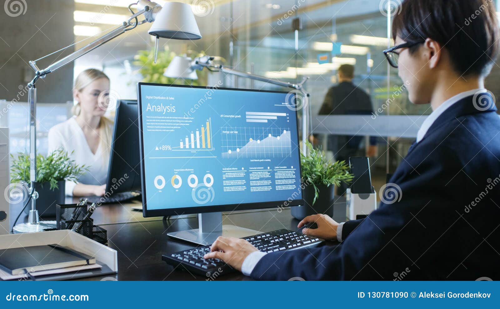 In the Office Businessman Works at His Desk, he`s Using Personal Stock ...