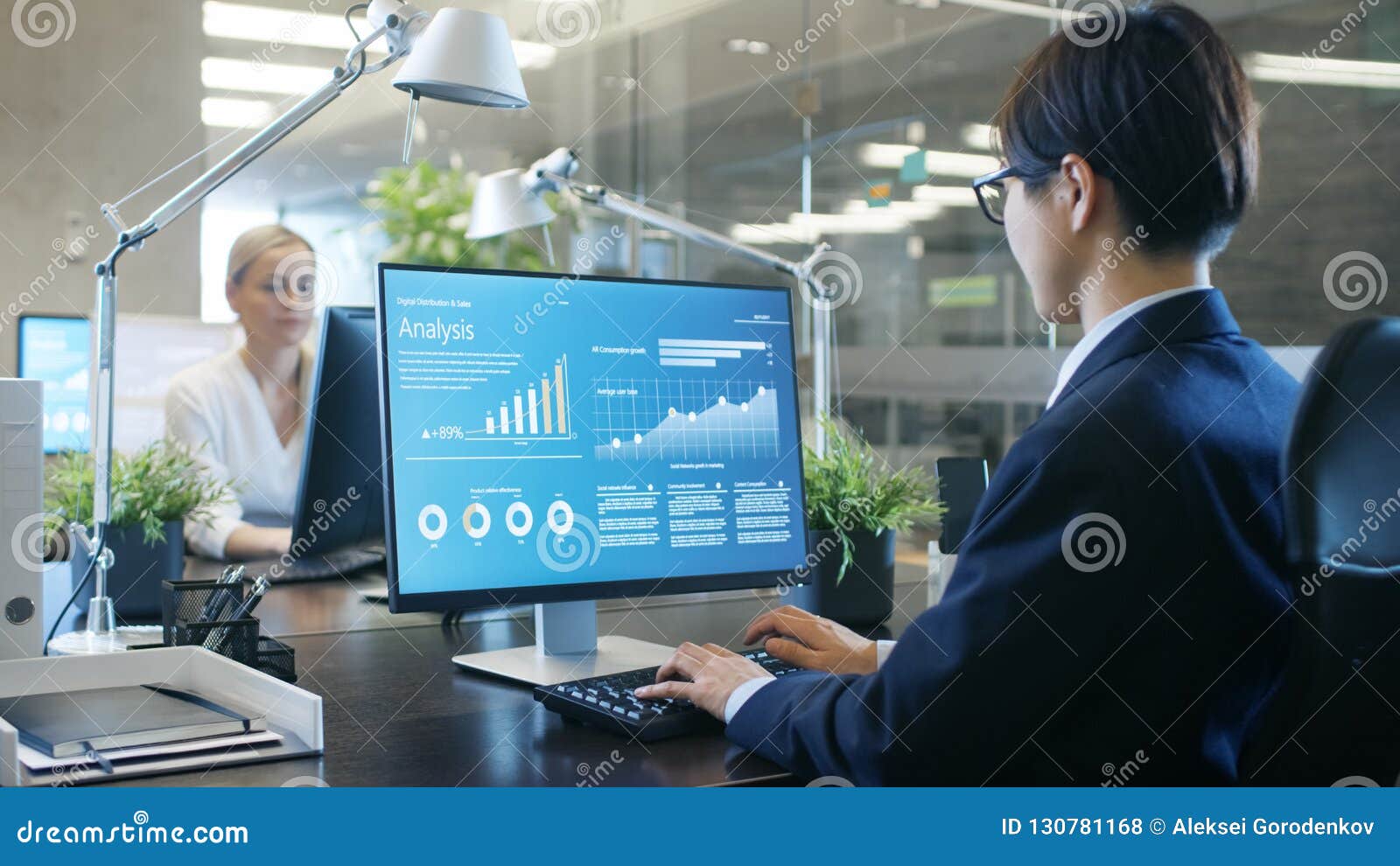 In the Office Businessman Works at His Desk, he`s Using Personal Stock ...