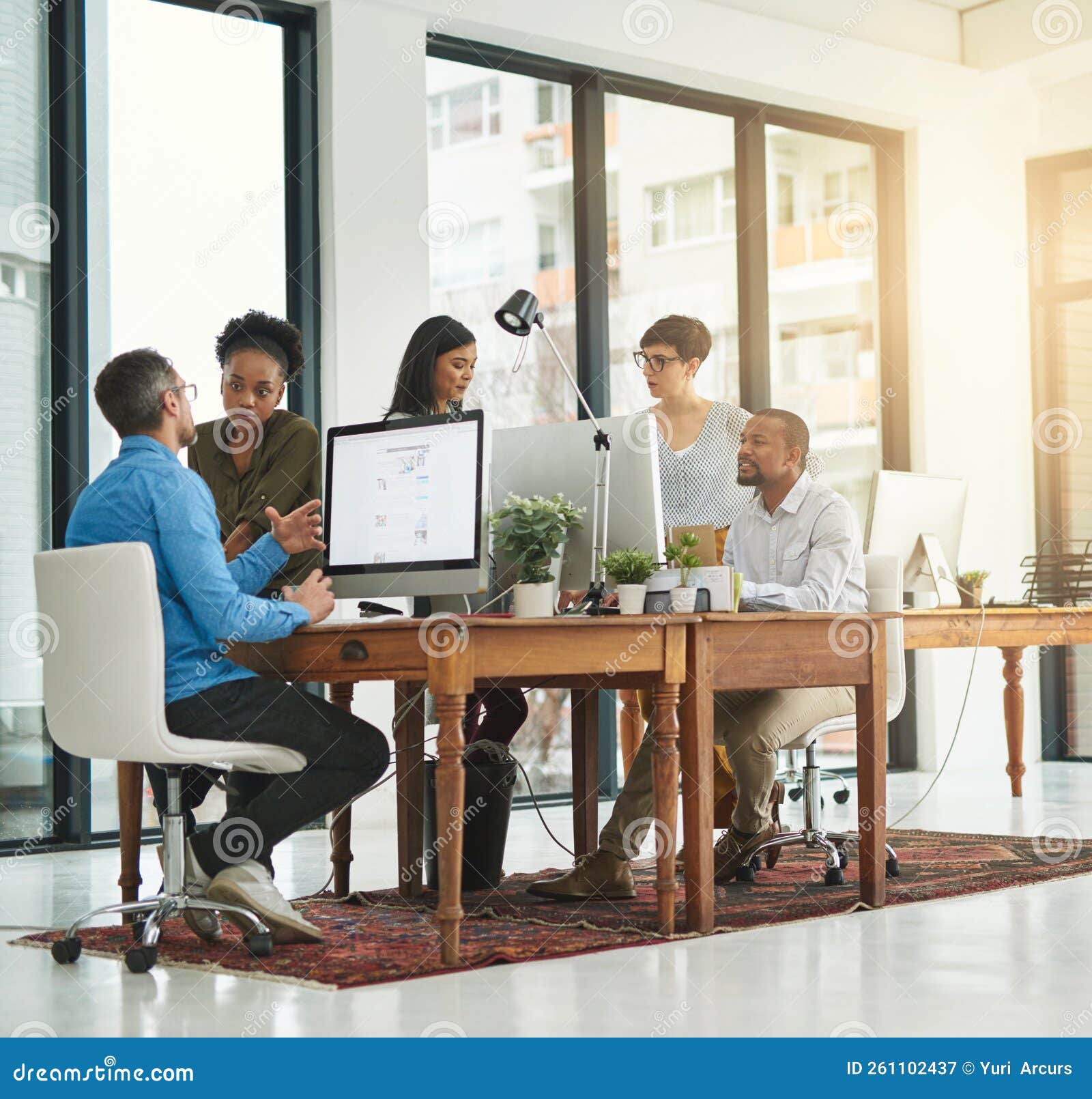 The Office is Busy. Full Length Shot of a Group of Colleagues Working ...