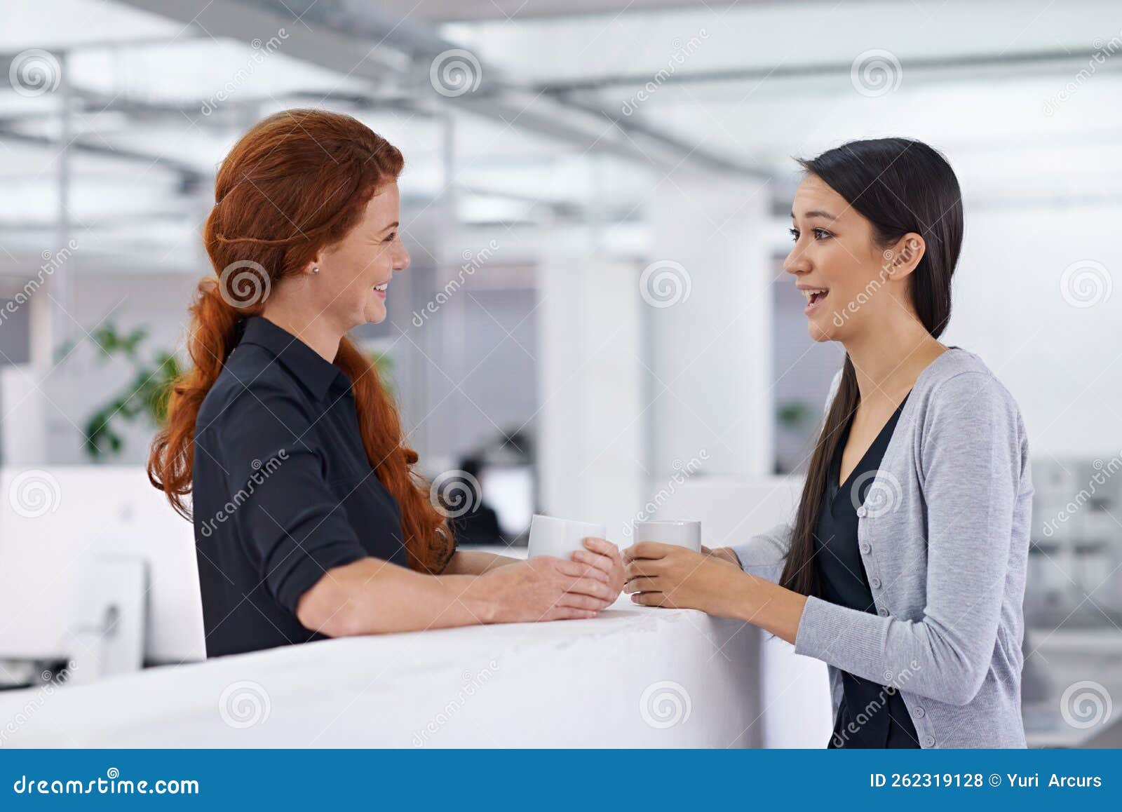 The Office Chatterboxes. Two Female Colleagues Sharing the Latest ...