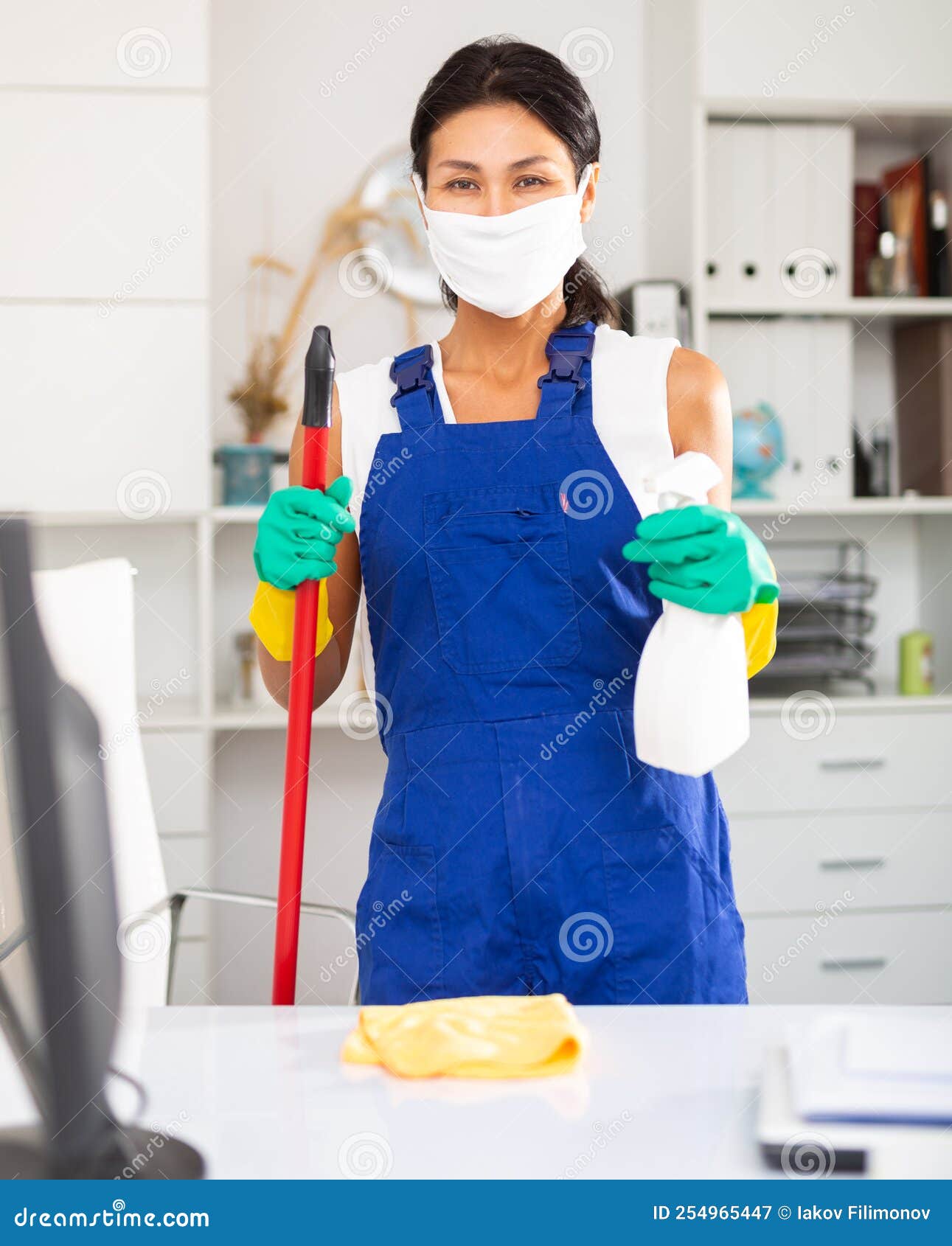 Office Cleaner in Protective Mask is Satisfied after Cleaning Stock ...