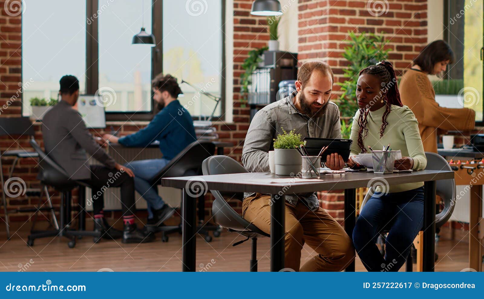 Office Colleagues Brainstorming Ideas To Plan Research Work Stock Image ...