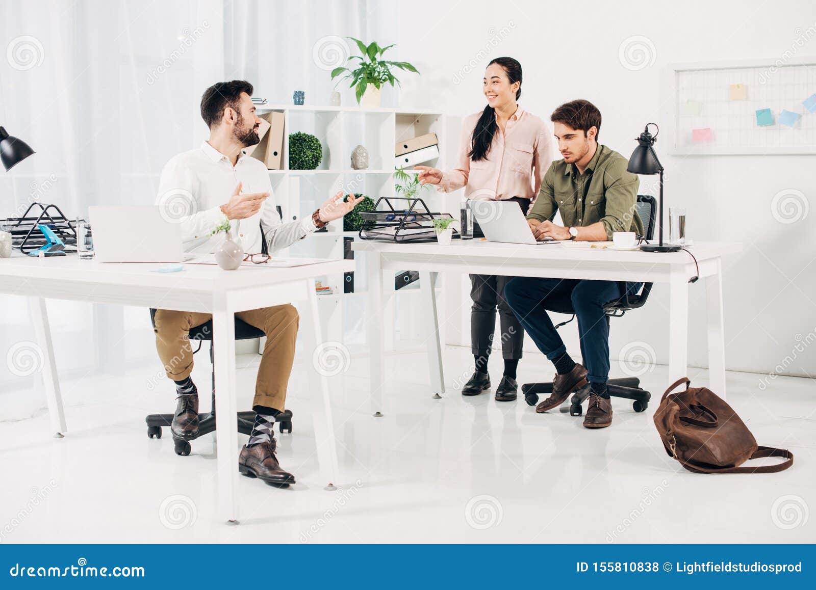 Office Colleagues Smiling and Talking Stock Photo - Image of cheerful ...