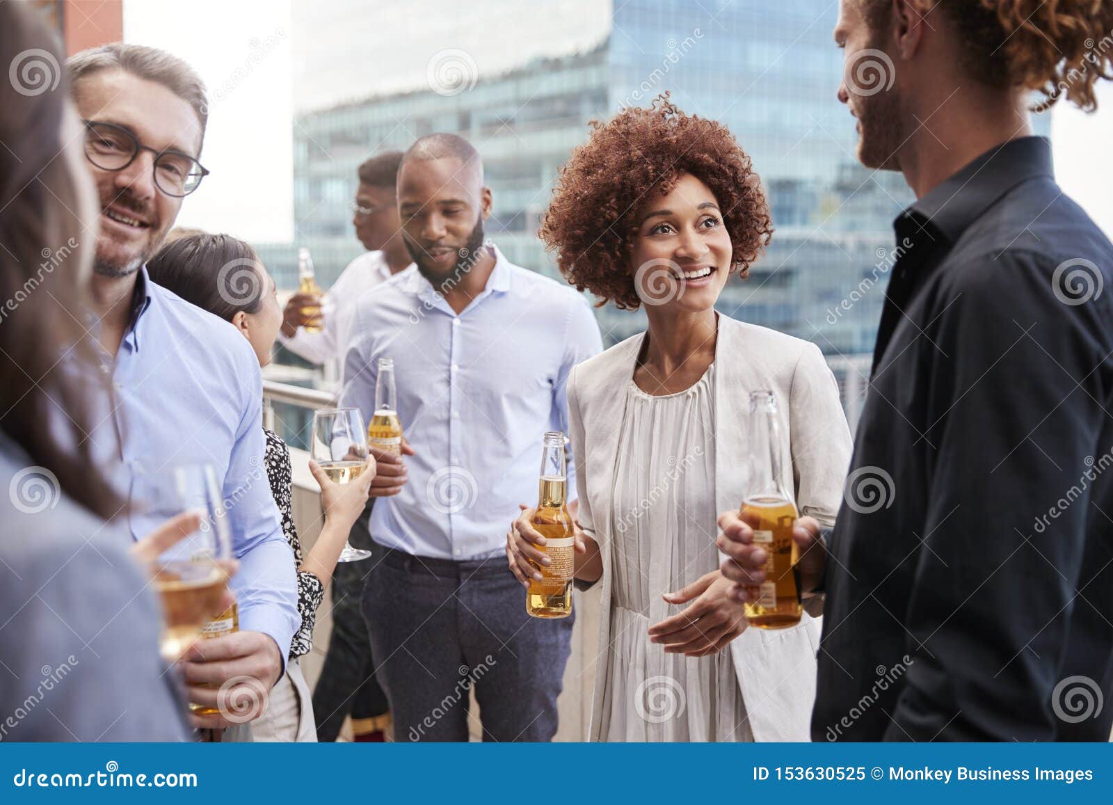 Office Colleagues Socialising with Drinks in the City after Work Stock ...