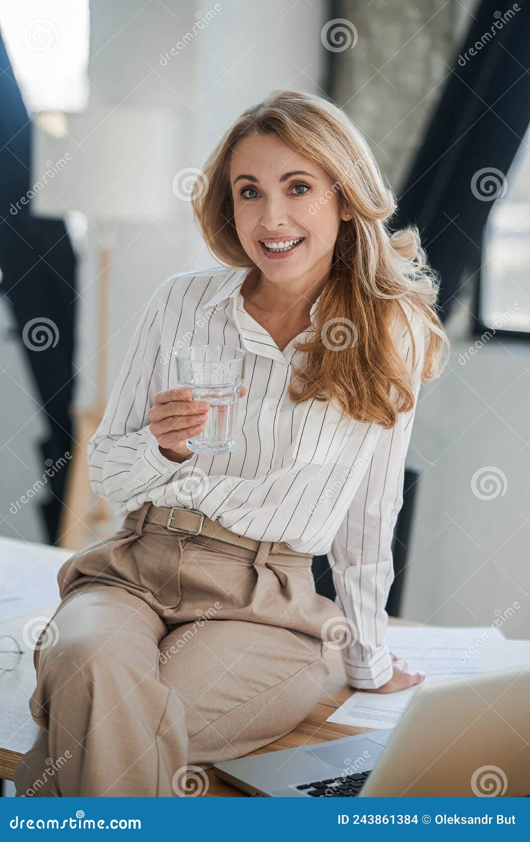 A Cute Woman Sitting on the Table in the Offcie Stock Photo - Image of ...