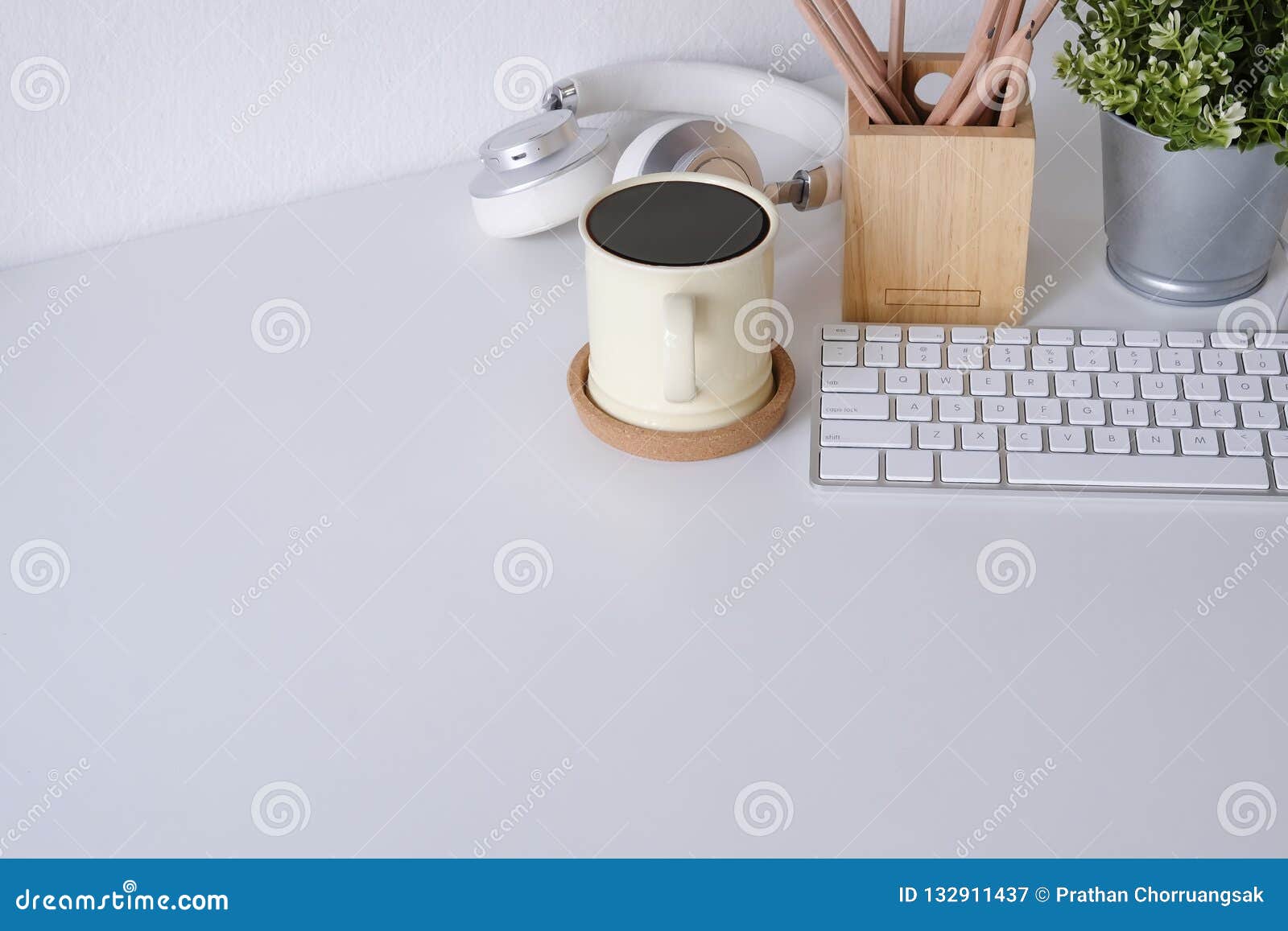 Office Desk Coffee Mug, Computer Keyboard, Pencil and Headphone Stock ...