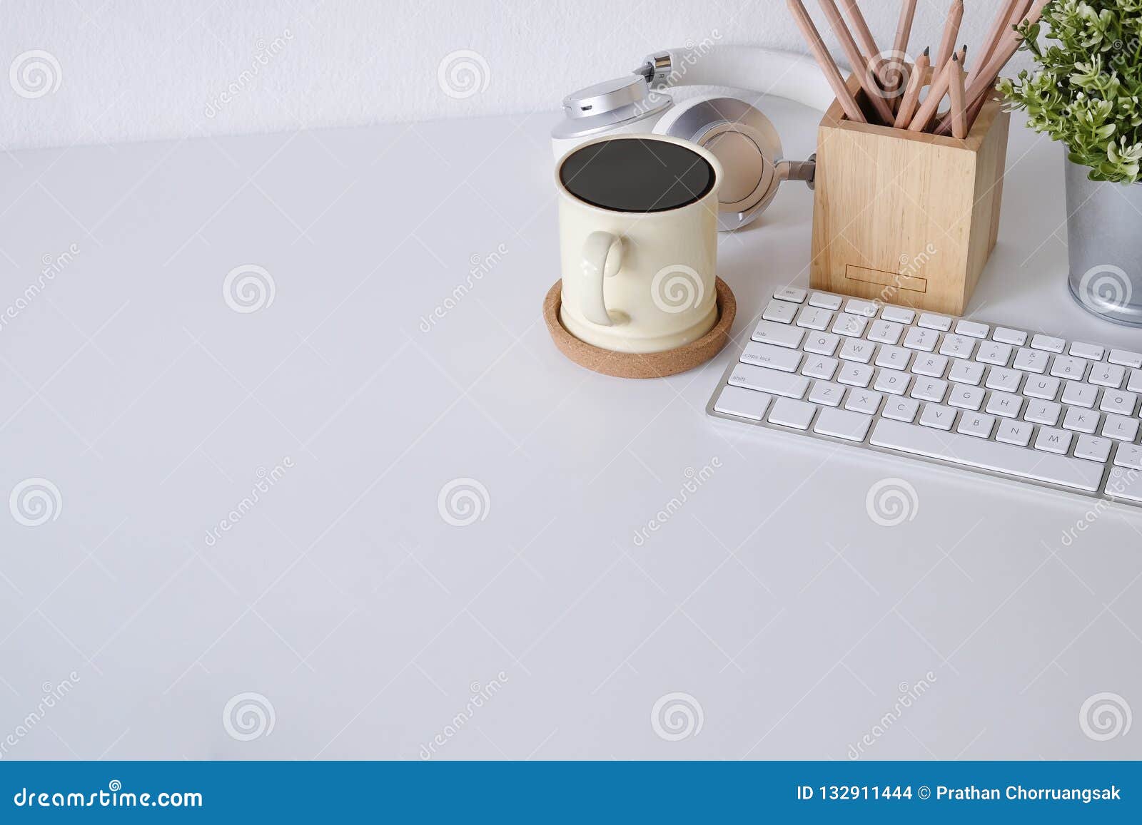 Office Desk Coffee Mug, Computer Keyboard, Pencil and Headphone Stock ...