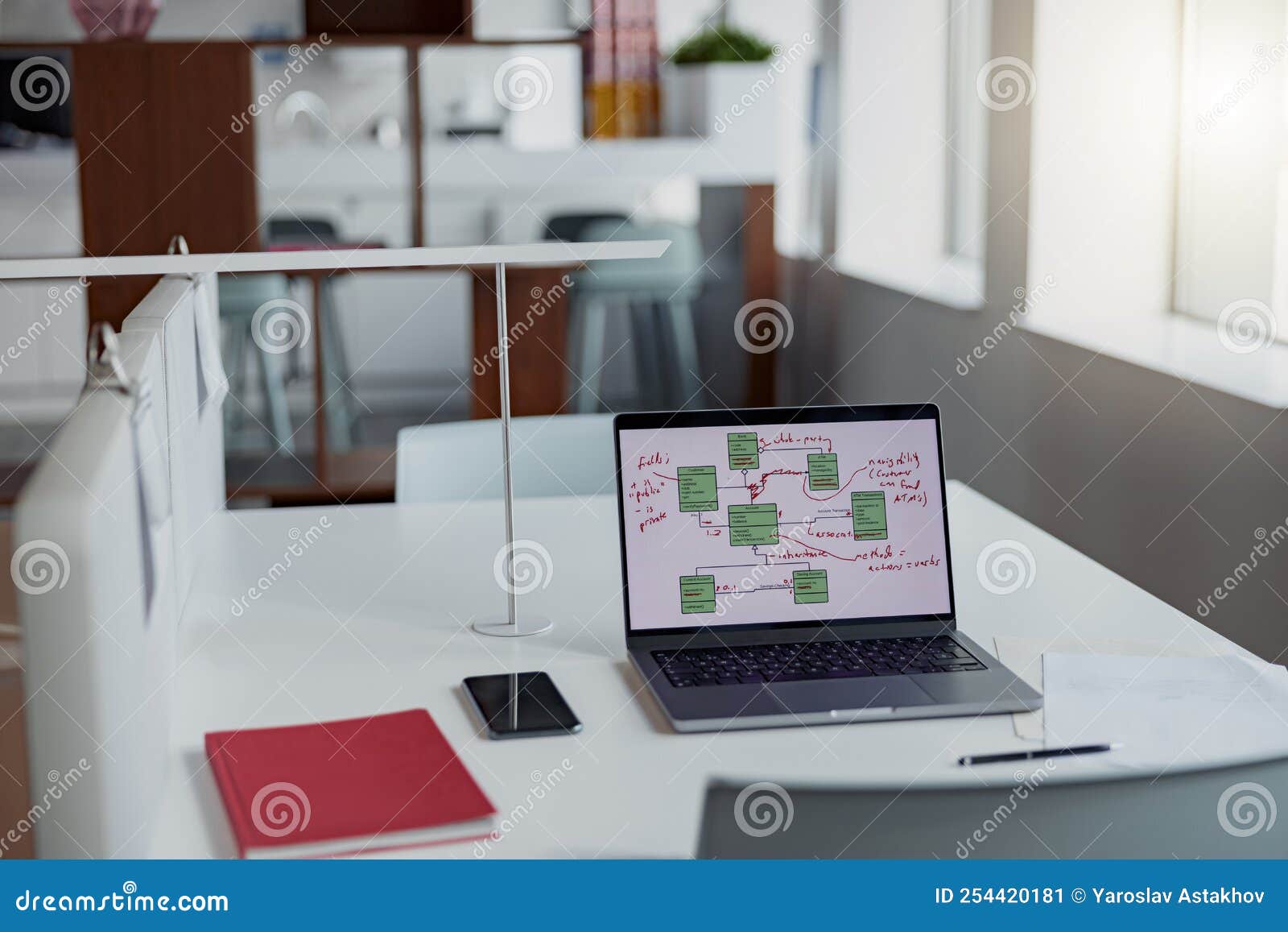 Office Desk with Laptop, Phone and Documents on Table in Modern Office ...
