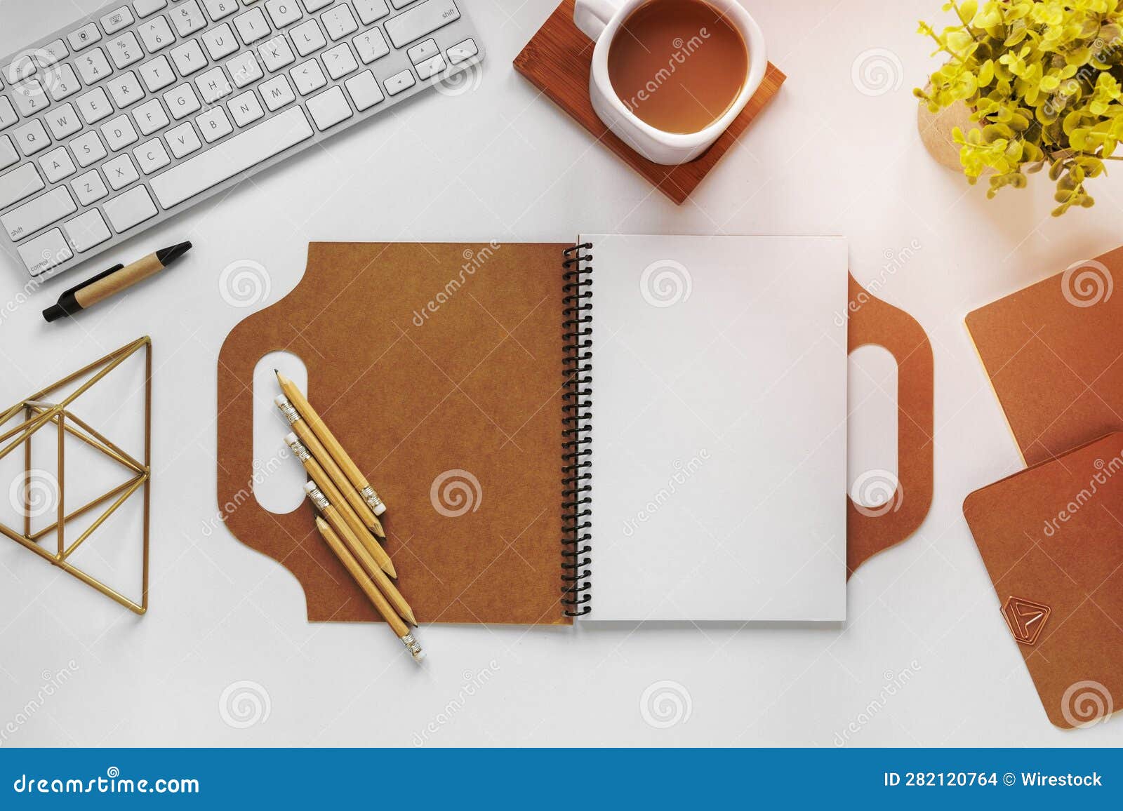 An Office Desk with Notebook, Laptop and Coffee on it Stock Photo ...