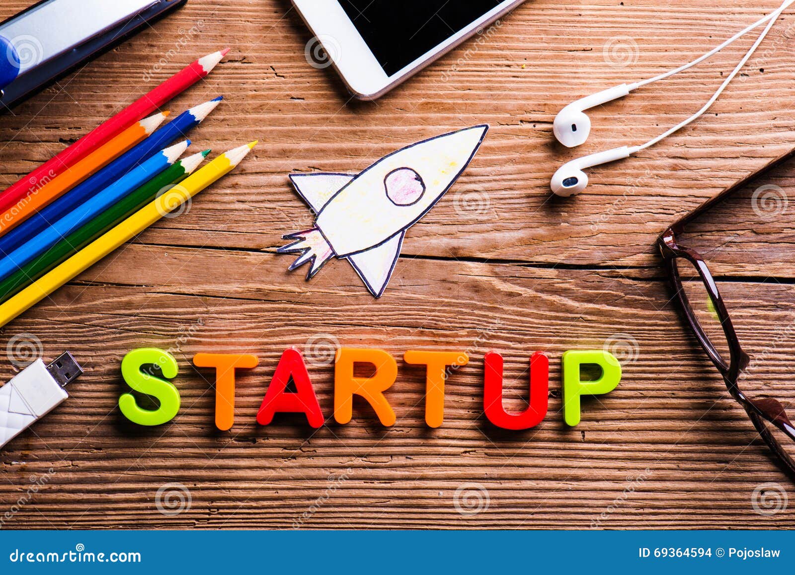 Office Desk with Start Up Sign and Various Objects. Stock Photo - Image ...