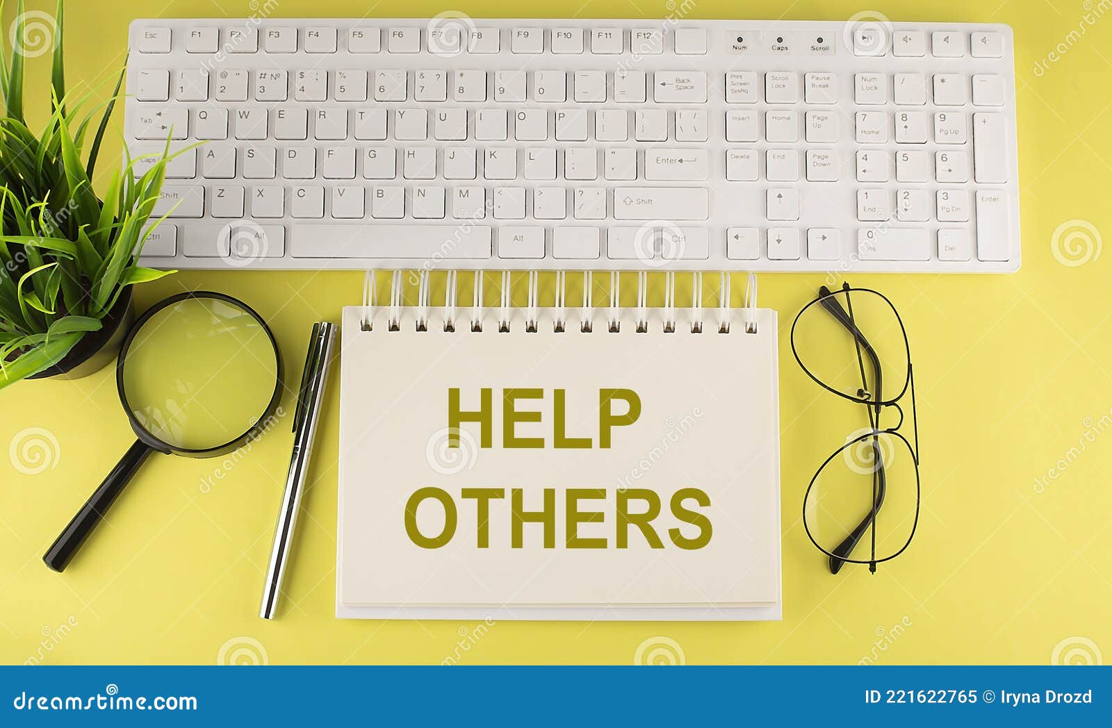 Office Desk Table Top View with Keyboard and Notebook Text HELP OTHERS ...