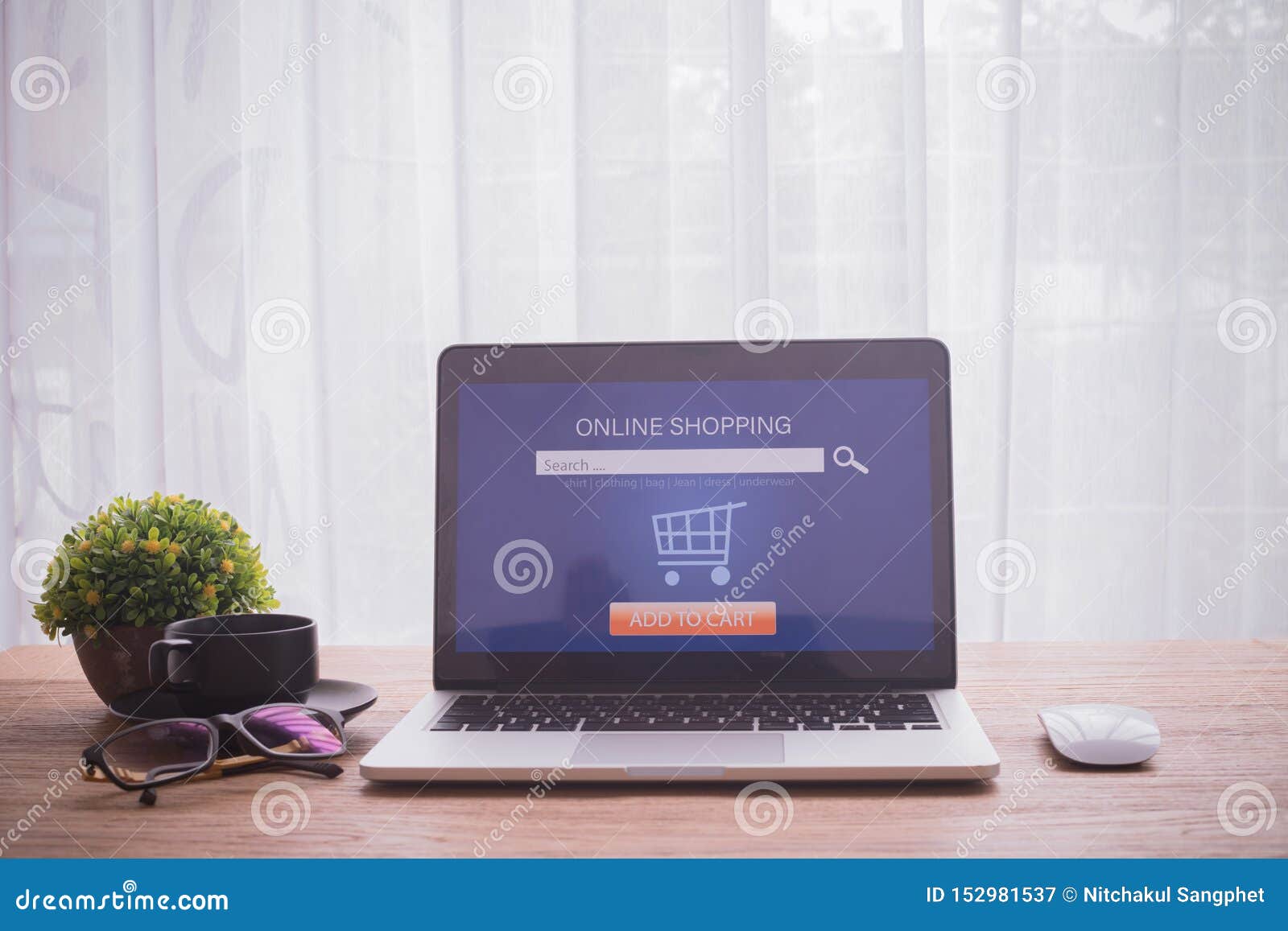 Office Desk with Virtual Online Shopping Website on Notebook Screen ...