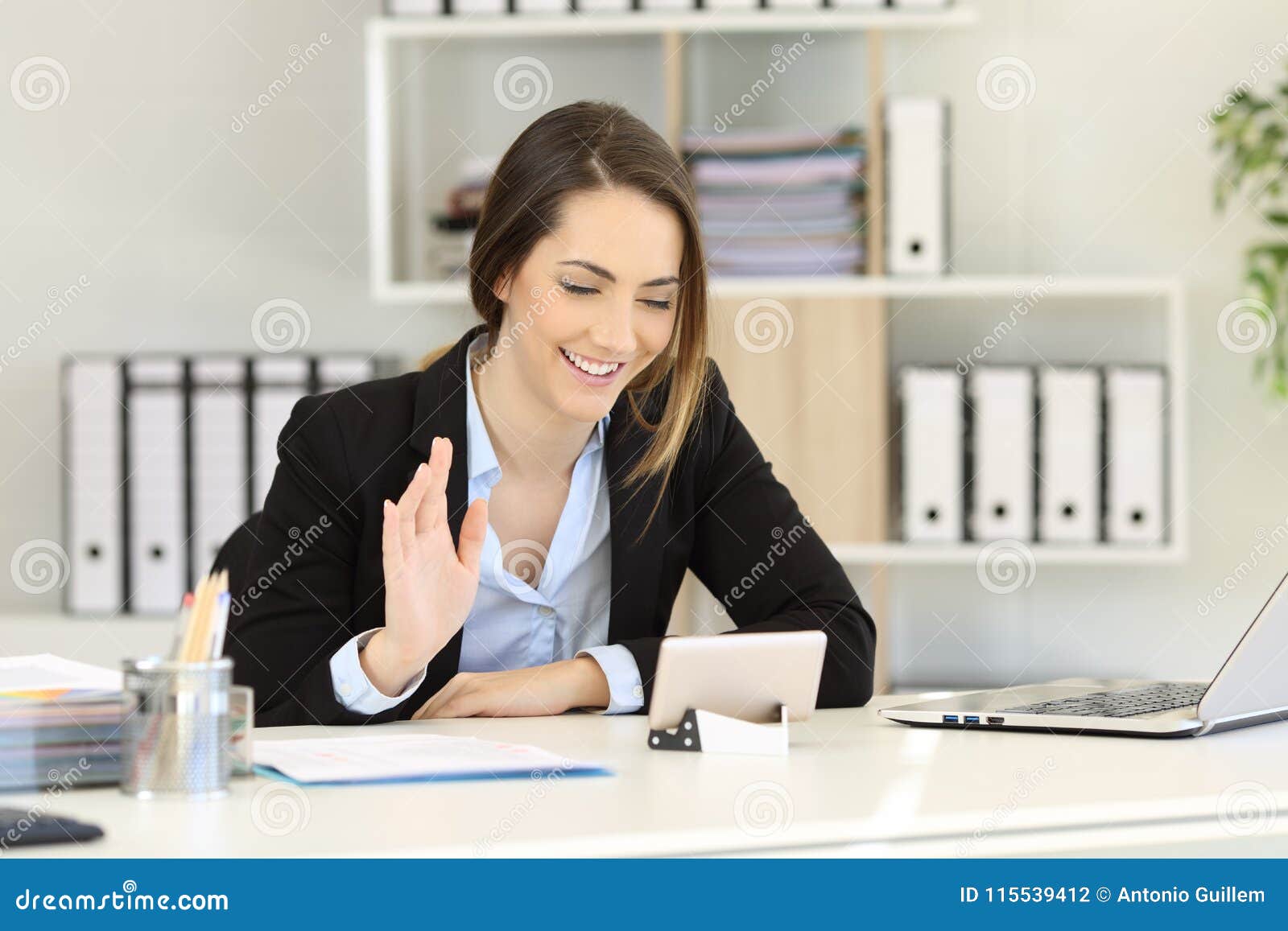 Office Employee Having a Video Call with a Smart Phone Stock Photo ...