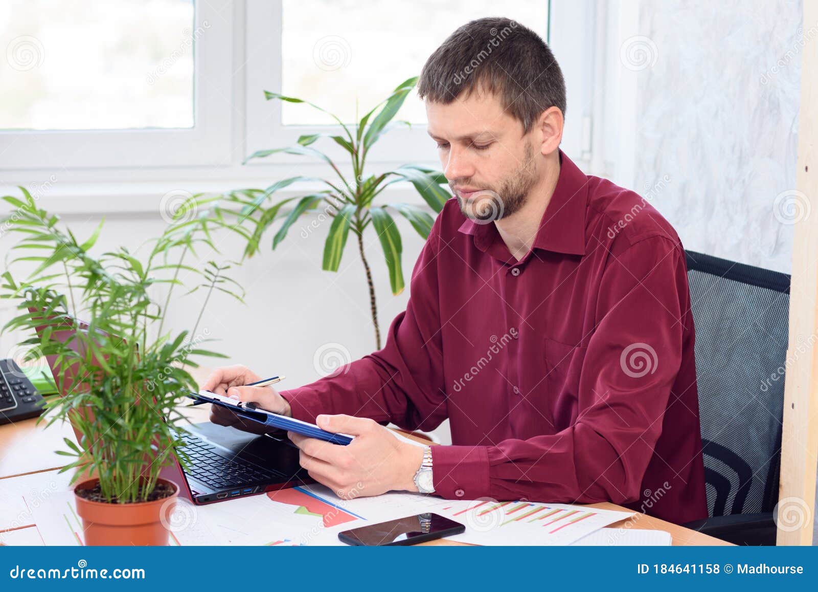 Office Employee Works on a Tablet in a Light Office Stock Photo - Image ...