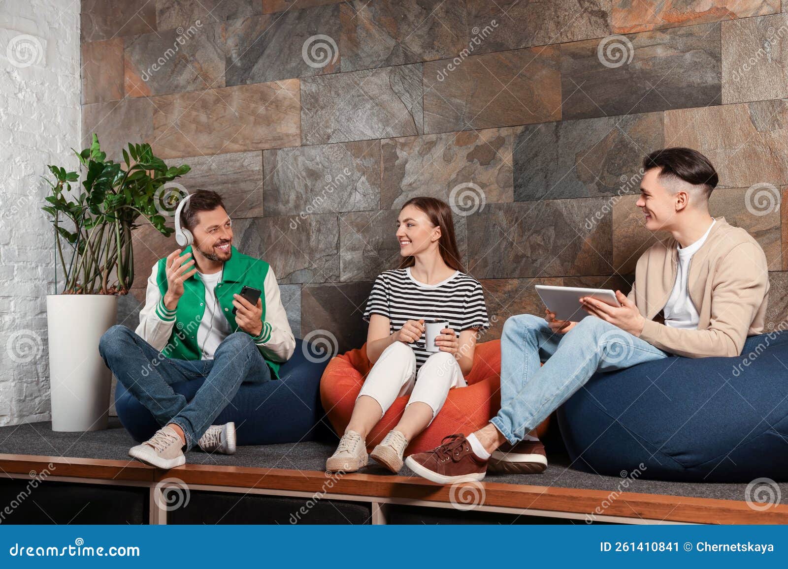 Office Employees Enjoying Break Together in Recreation Room at Work ...