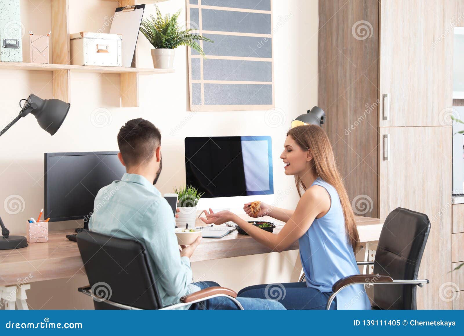 Office Employees Having Lunch at Workplace. Stock Image - Image of ...