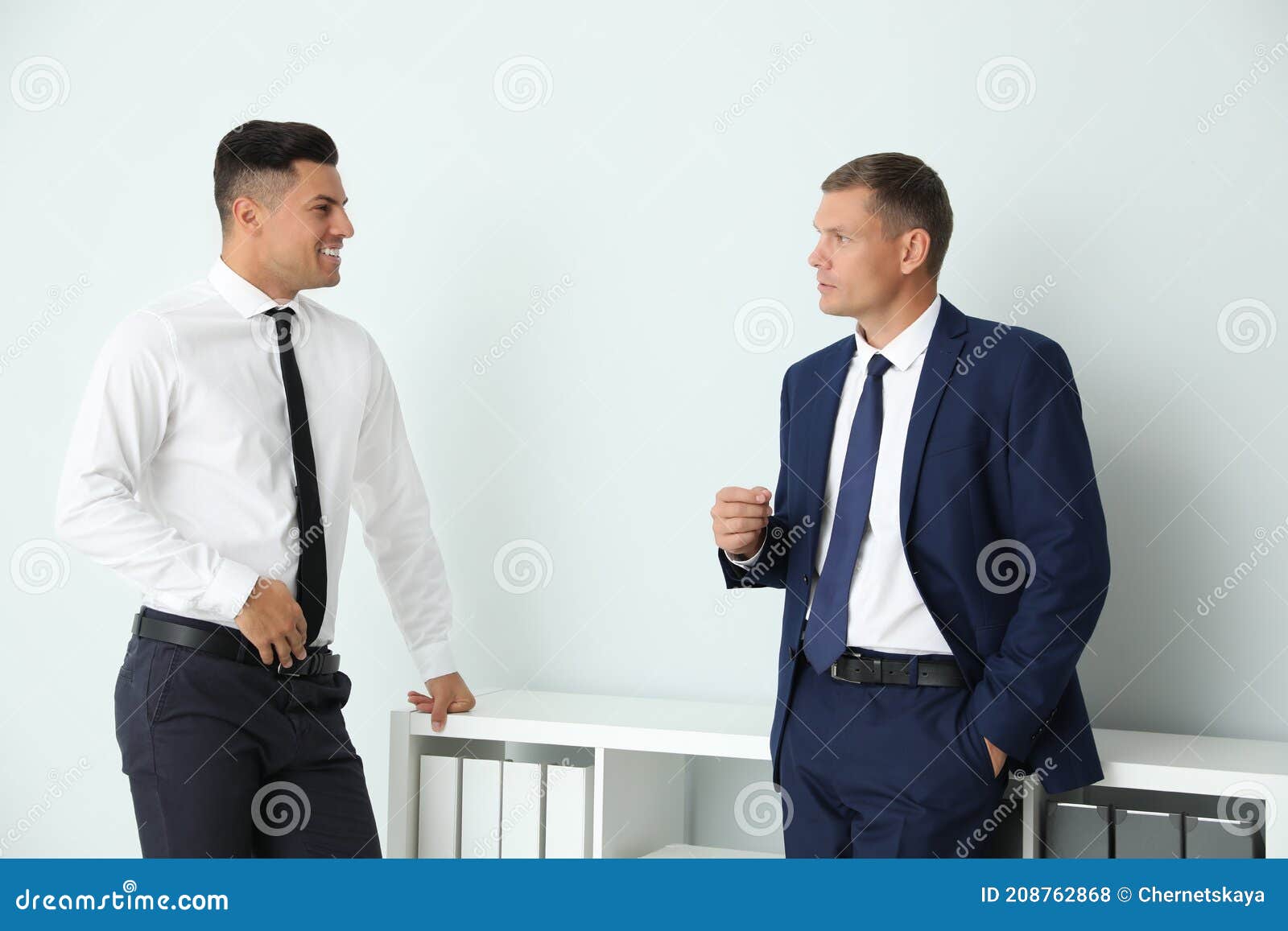 Office Employees Talking at Workplace during Break Stock Photo - Image ...
