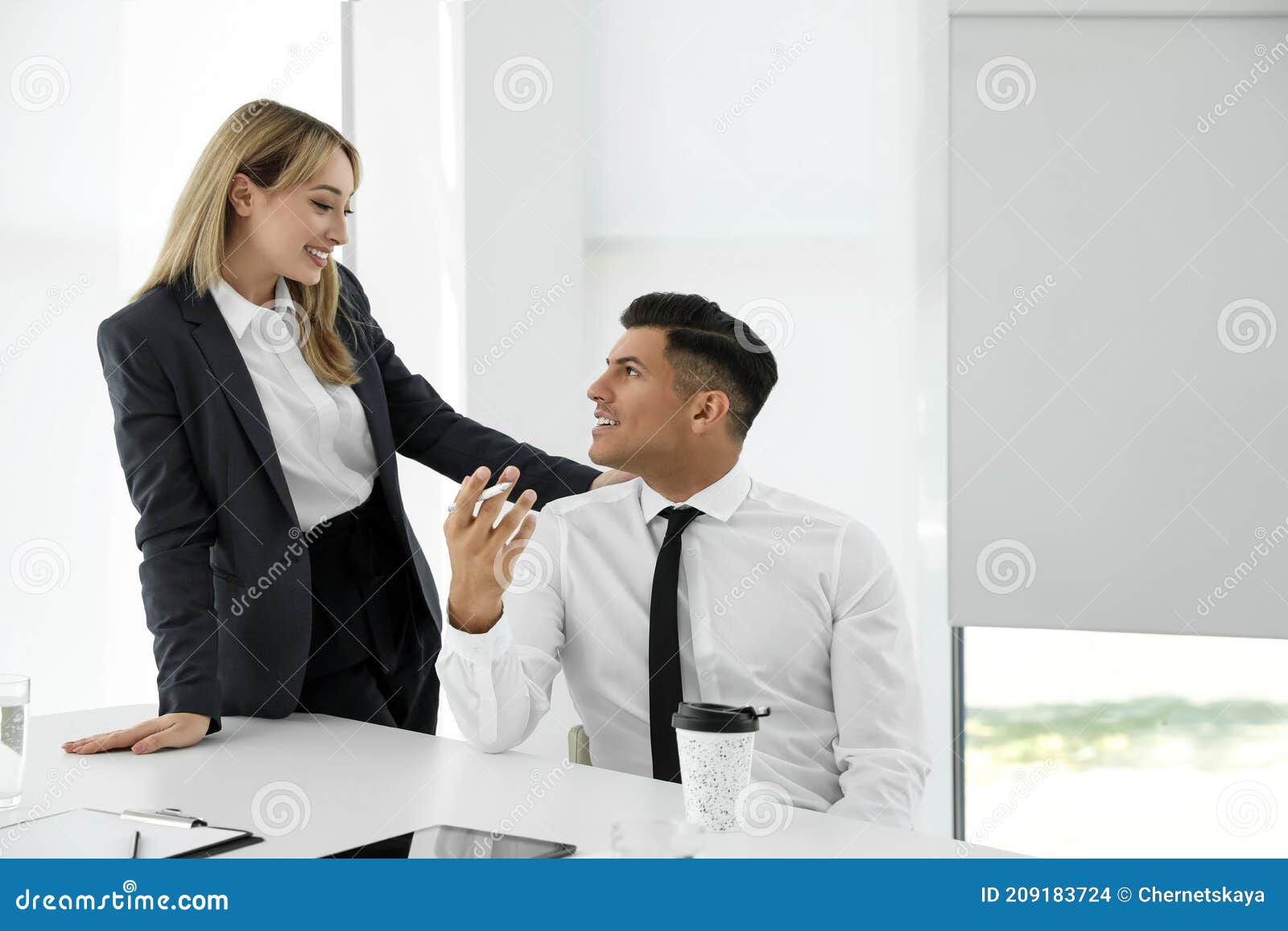 Office Employees Talking at Workplace during Break Stock Photo - Image ...